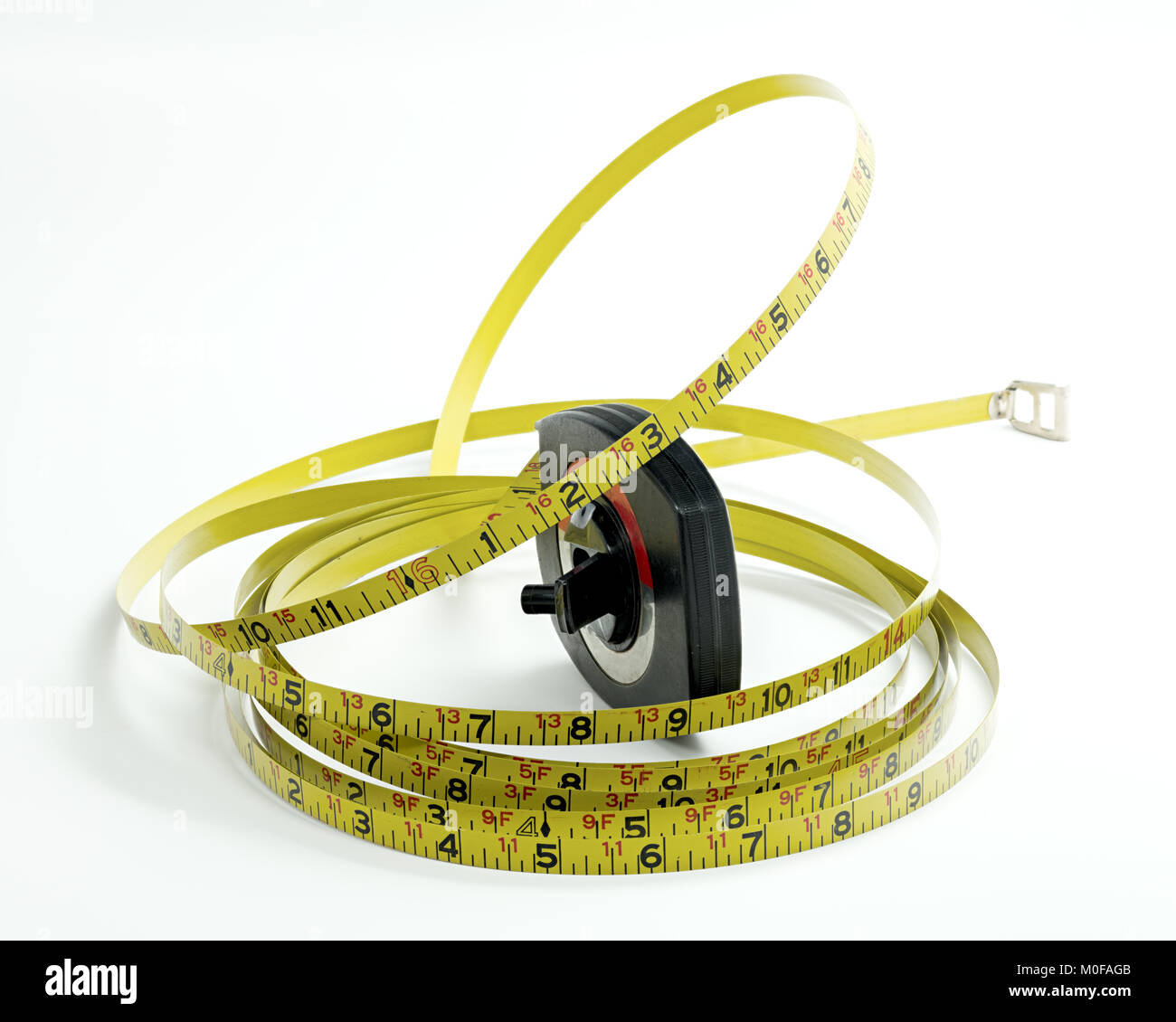 Numbered metal and plastic measuring tape unraveled Stock Photo - Alamy
