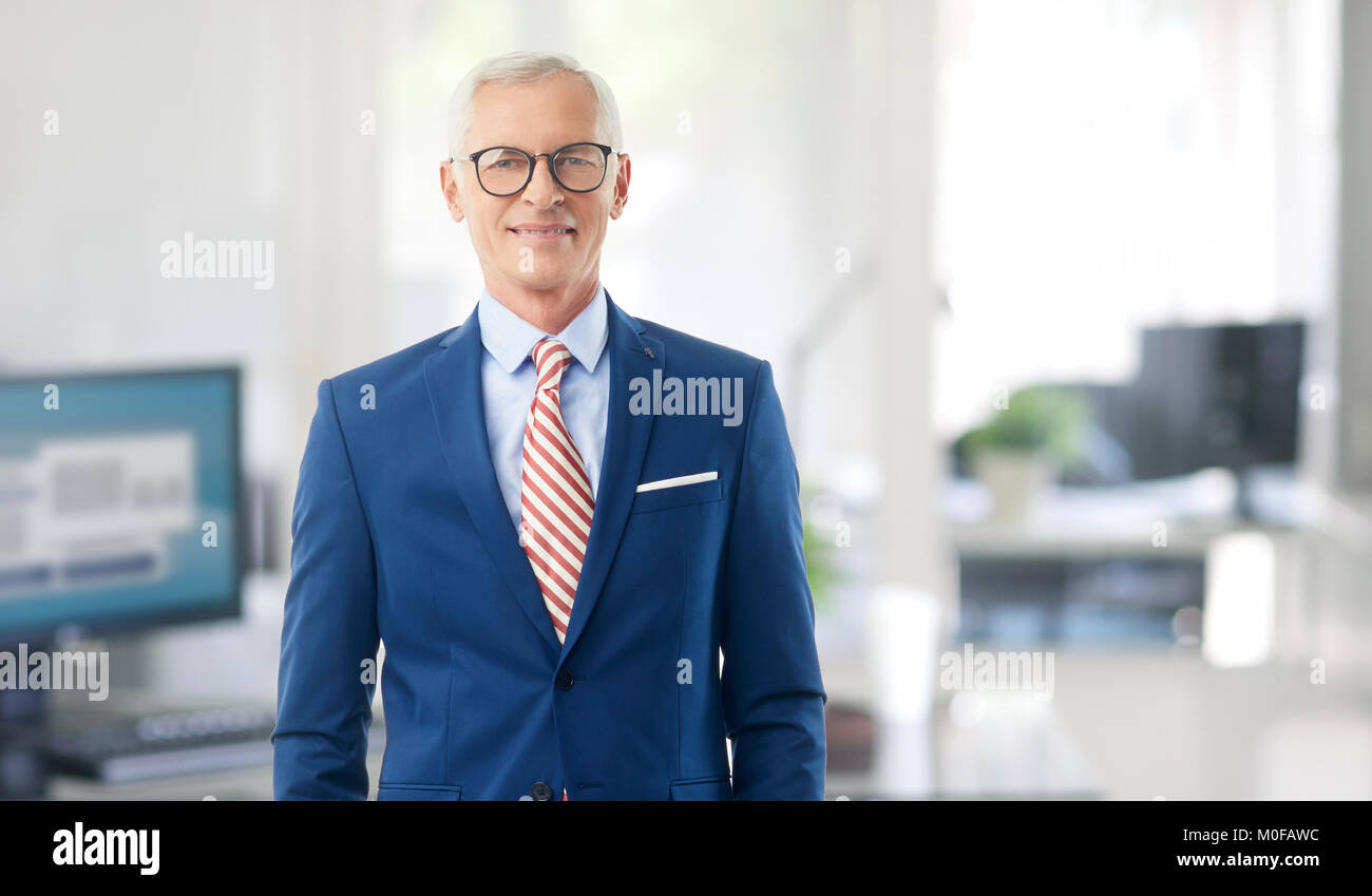 Smiling senior financial advisor businessman wearing suit and eyewear ...