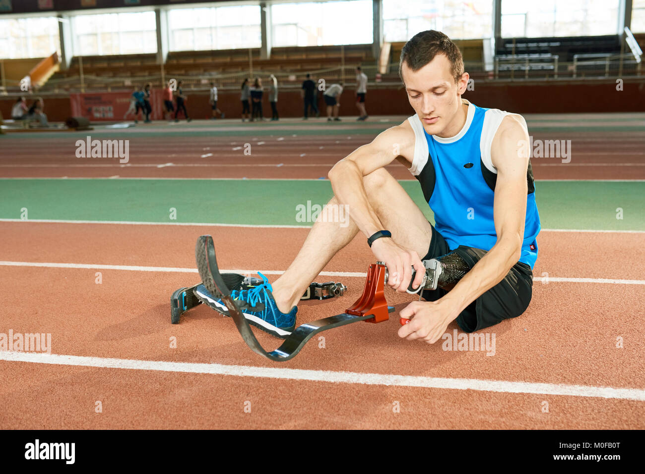 Handicapped Sportsman Putting on Prosthetic Foot Stock Photo - Alamy