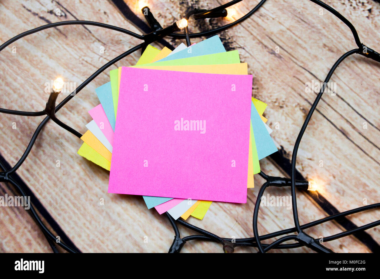 Multicolored paper stickers sticky note on wooden background. Blank ...
