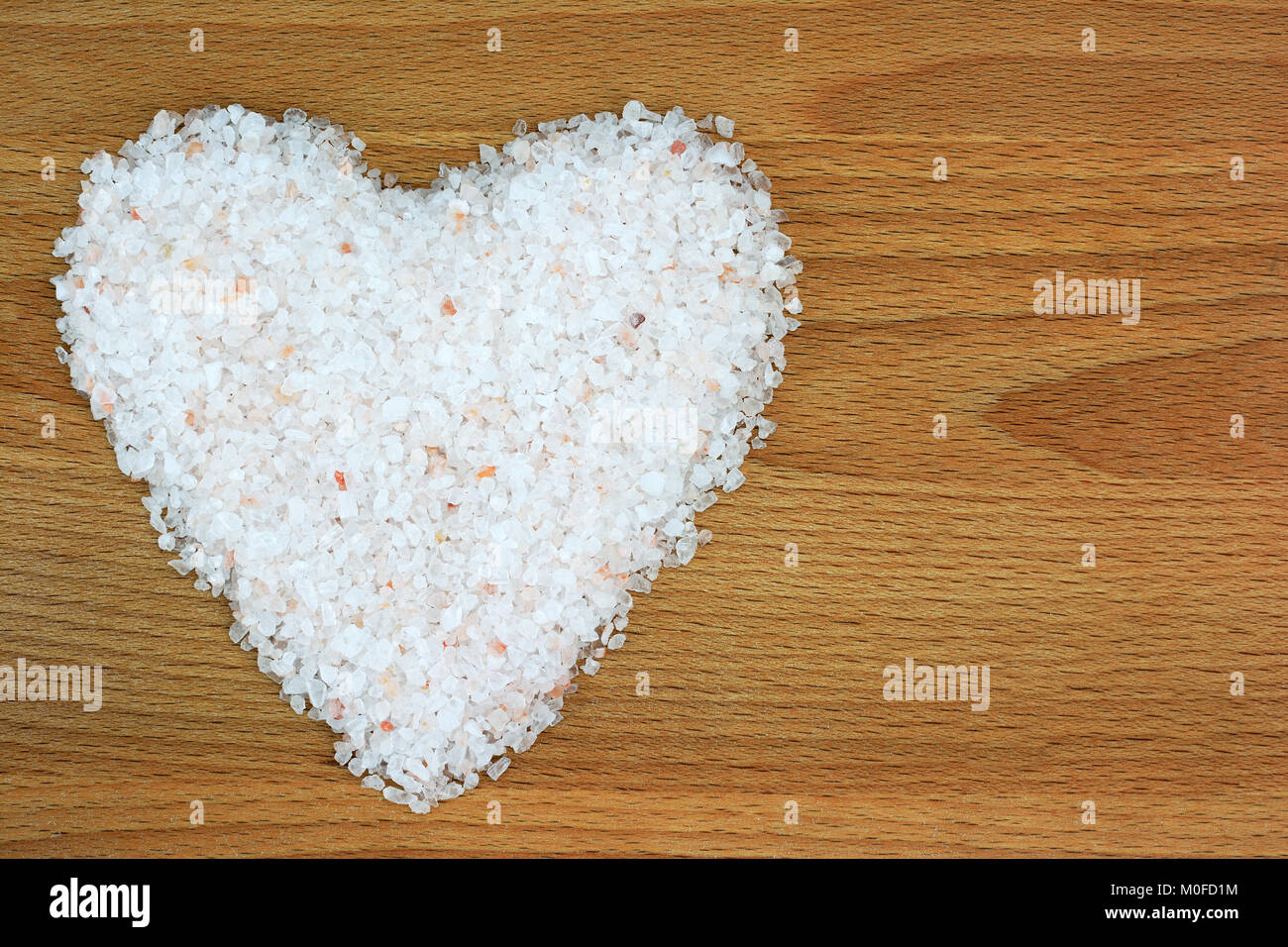 Himalayan salt in heart shape Stock Photo - Alamy