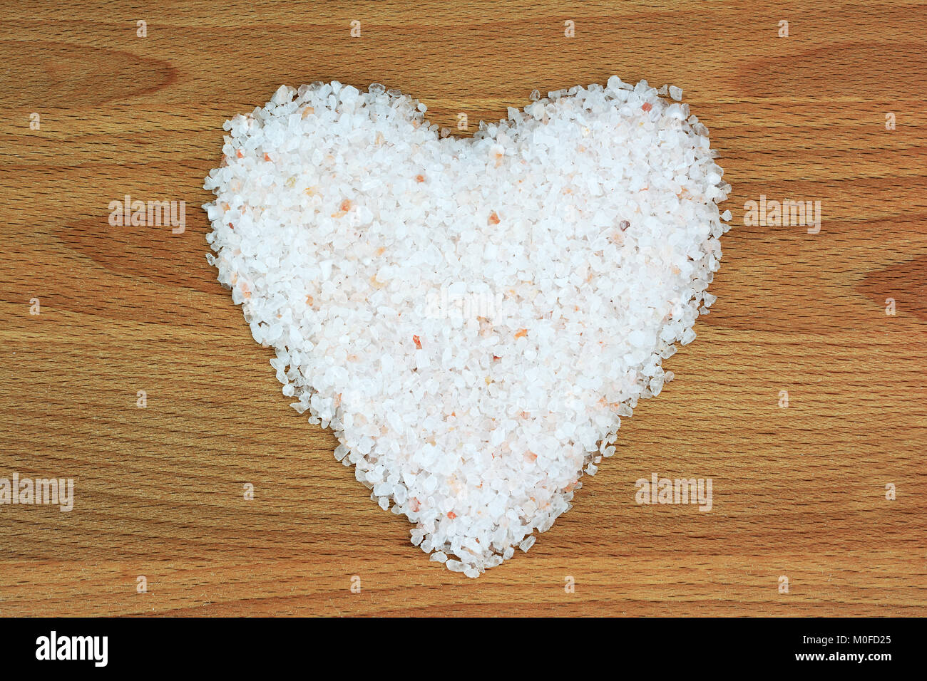 Himalayan salt in heart shape Stock Photo - Alamy