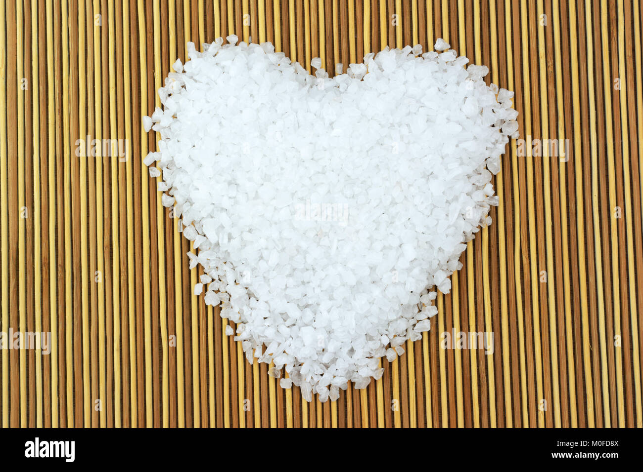 Sea salt in heart shape Stock Photo - Alamy