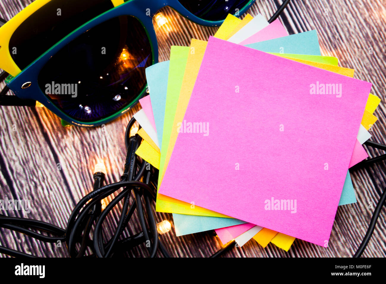 Place for writing sticky note pinned on the wooden background with ...