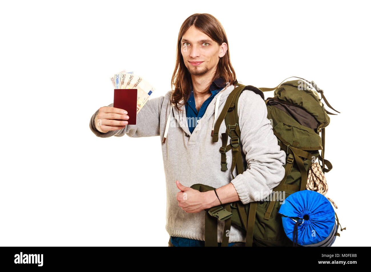 Man tourist backpacker holding passport full of money. Young guy hiker ...