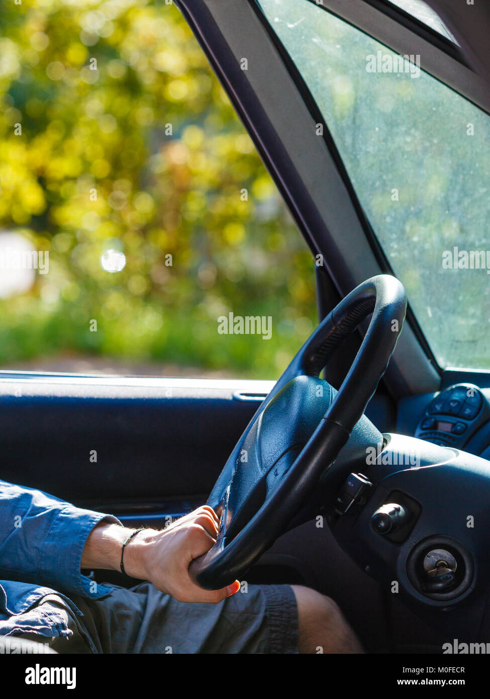 Auto equipment, male driver concept. Man hands on steering wheel ...