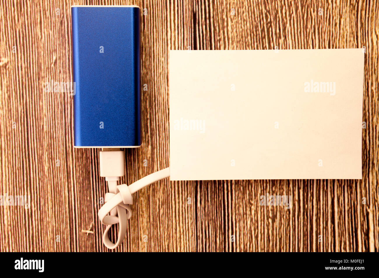 sticky note paper charging with energy bank. Depth of field on Power ...