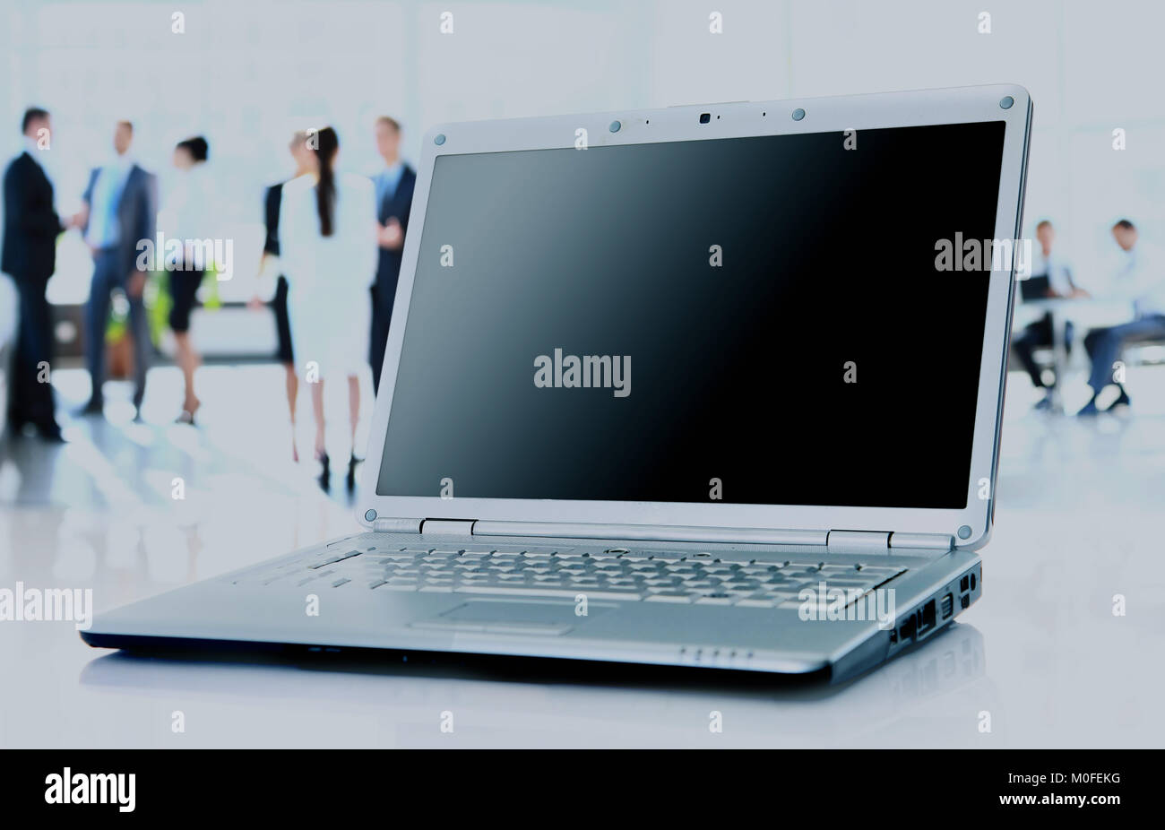 Modern laptop isolated on white with reflections on glass table Stock ...