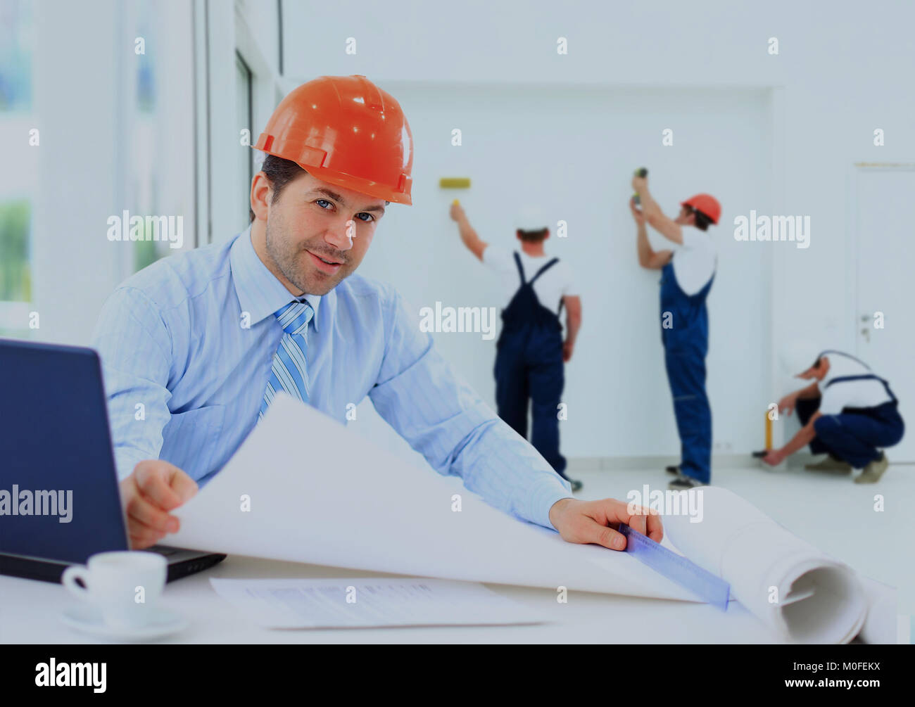 chief architect and his team in the background Stock Photo - Alamy