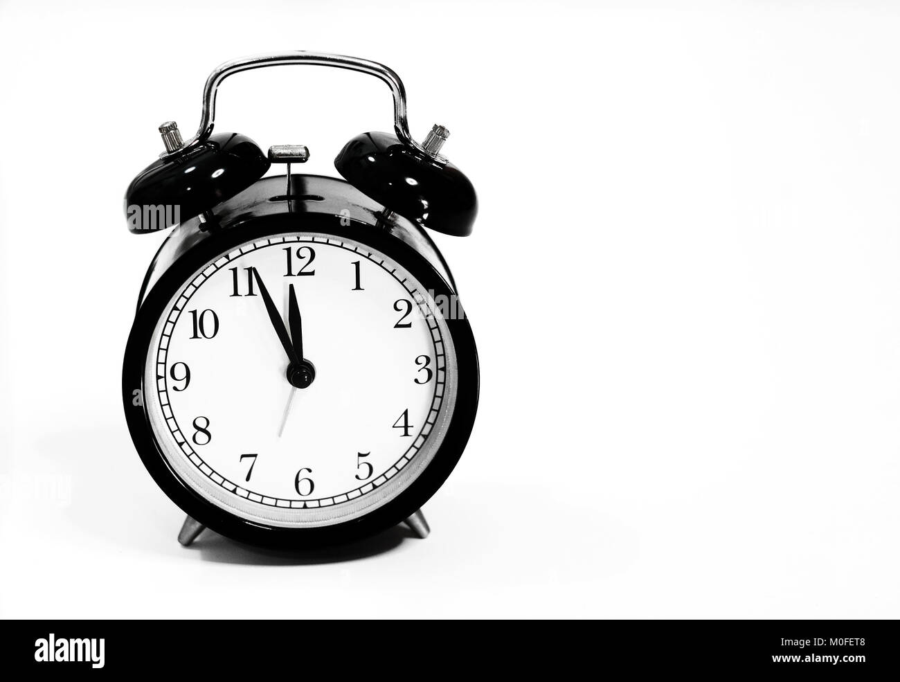 alarm clock isolated white background.rule of third Stock Photo - Alamy