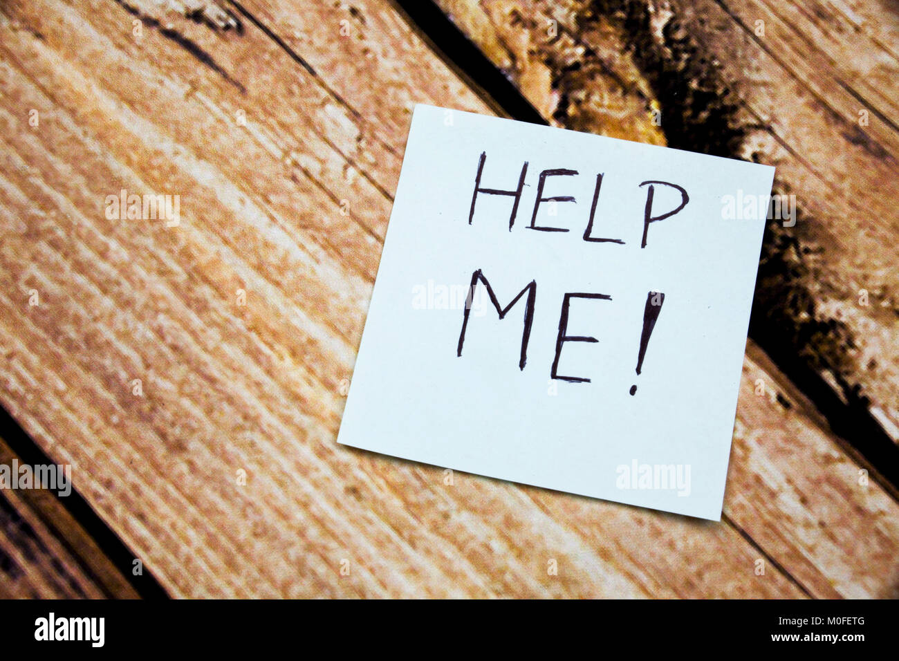 Help me written on a sticky note on the wooden background Stock Photo ...