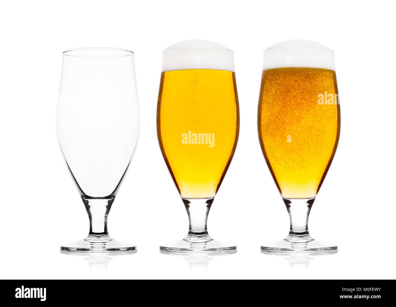 Cold elegant glasses of lager beer with isolated on white background ...