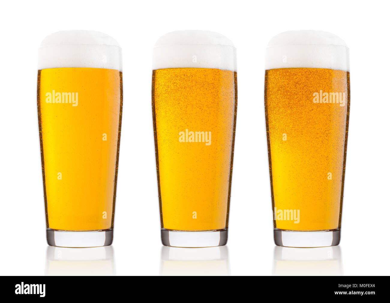 Cold elegant glasses of lager beer with isolated on white background ...
