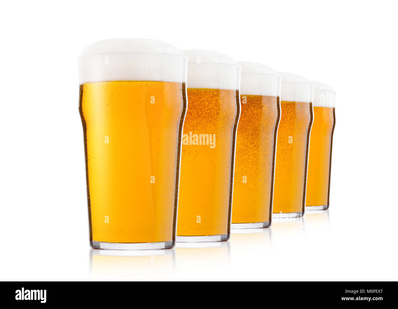 Cold elegant glasses of lager beer with isolated on white background ...