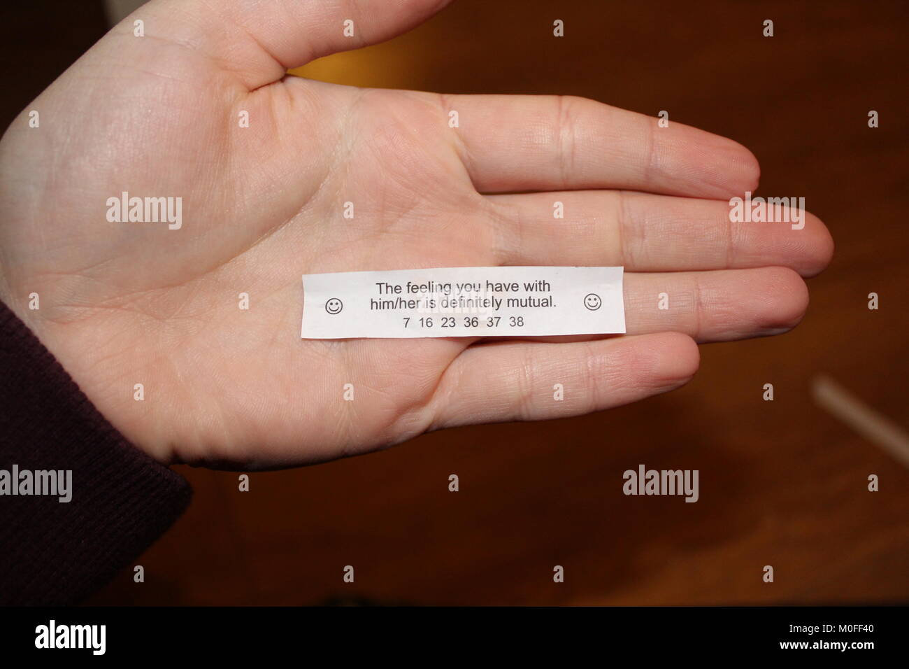 Hand holding fortune Stock Photo - Alamy