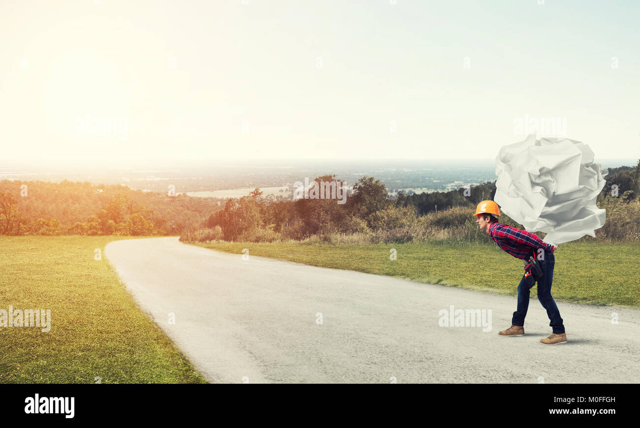 Engineer man carry load Stock Photo - Alamy