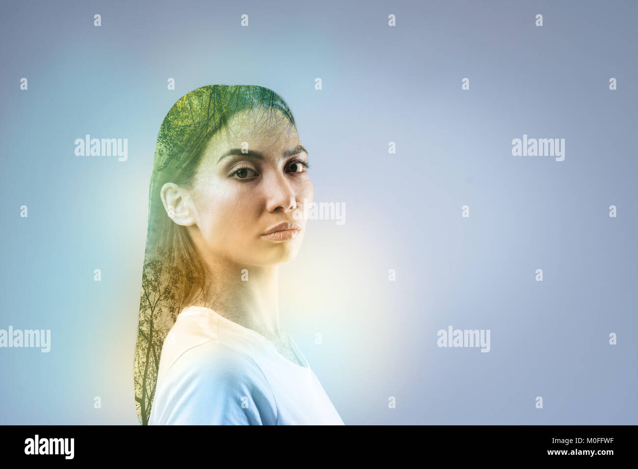 Attractive model standing isolated on grey Stock Photo - Alamy