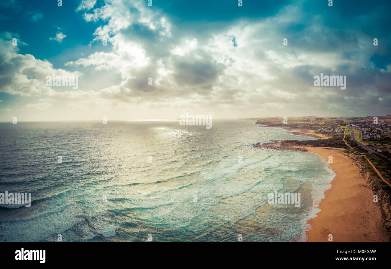 Beautiful cloudscape over ocean coastline at sunset. Kilcunda, Victoria ...