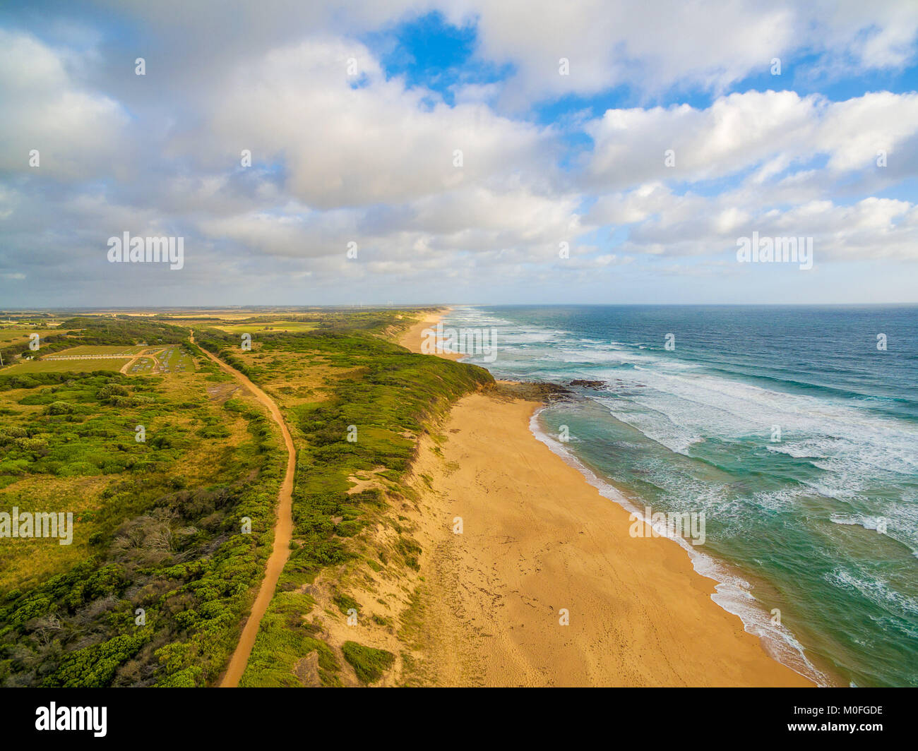 Aerial view of Australian countryside and ocean coastline at sunset ...