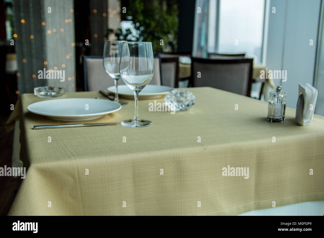 Restaurant empty table for two with window view Stock Photo - Alamy