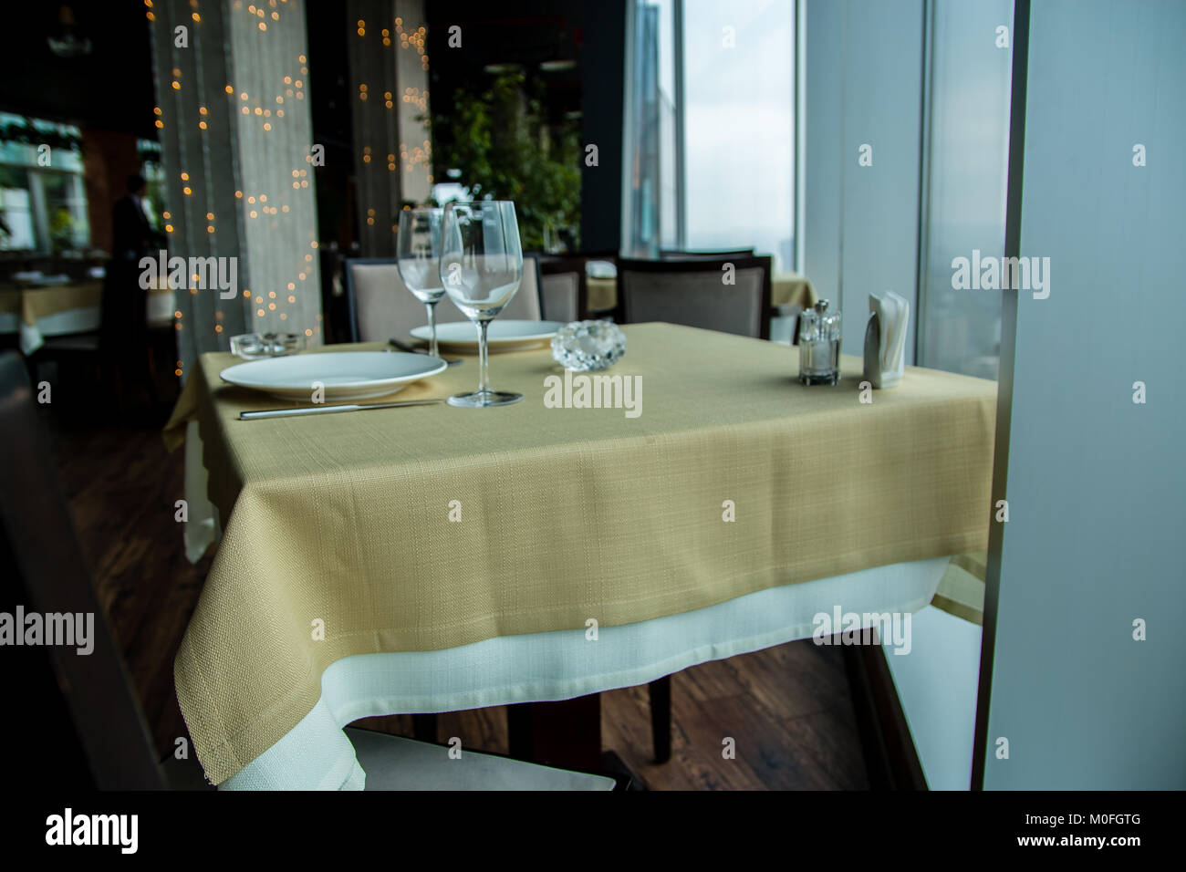 Restaurant empty table for two with window view Stock Photo - Alamy