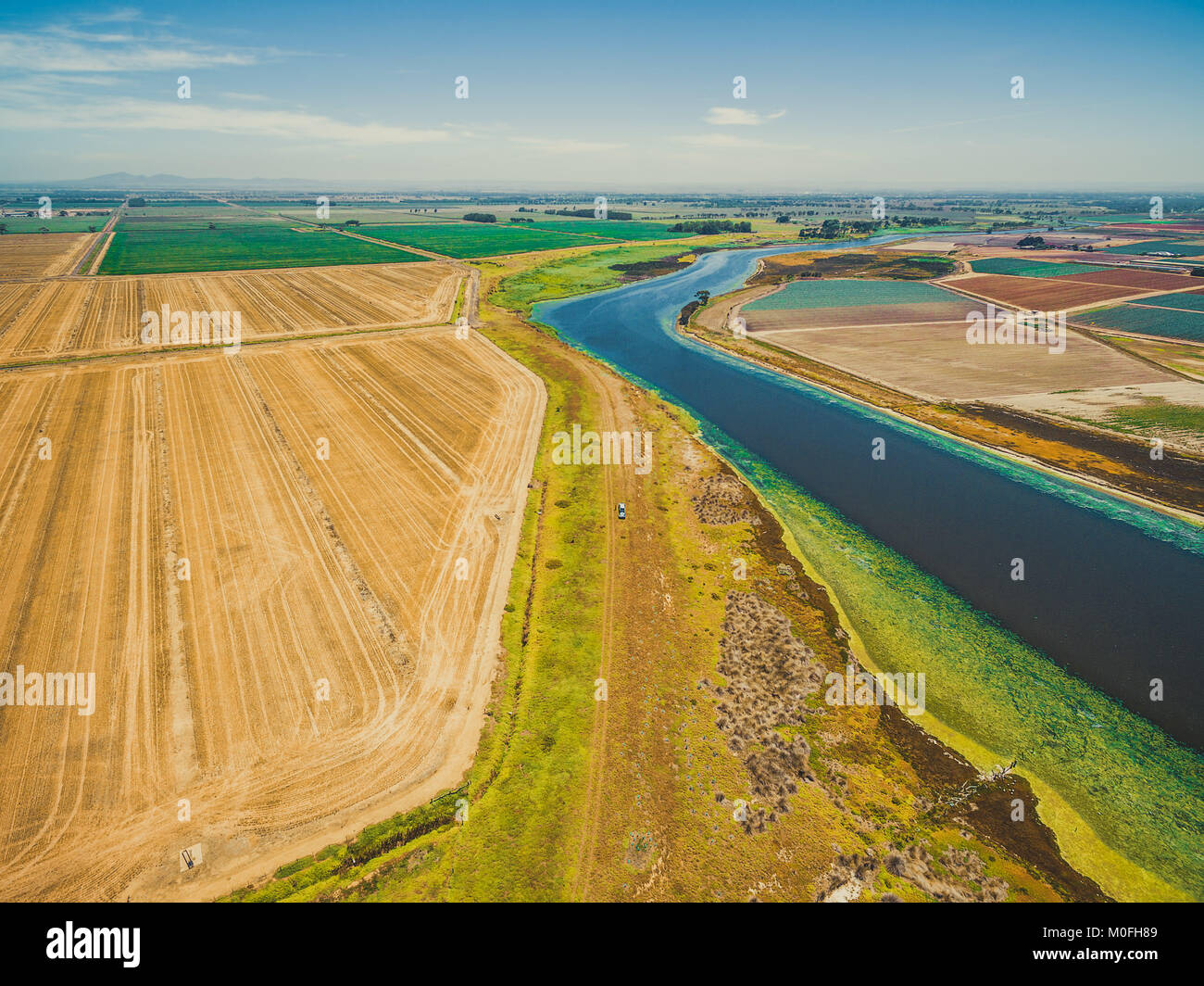 Aerial view of Werribee river flowing among fields, meadows and ...