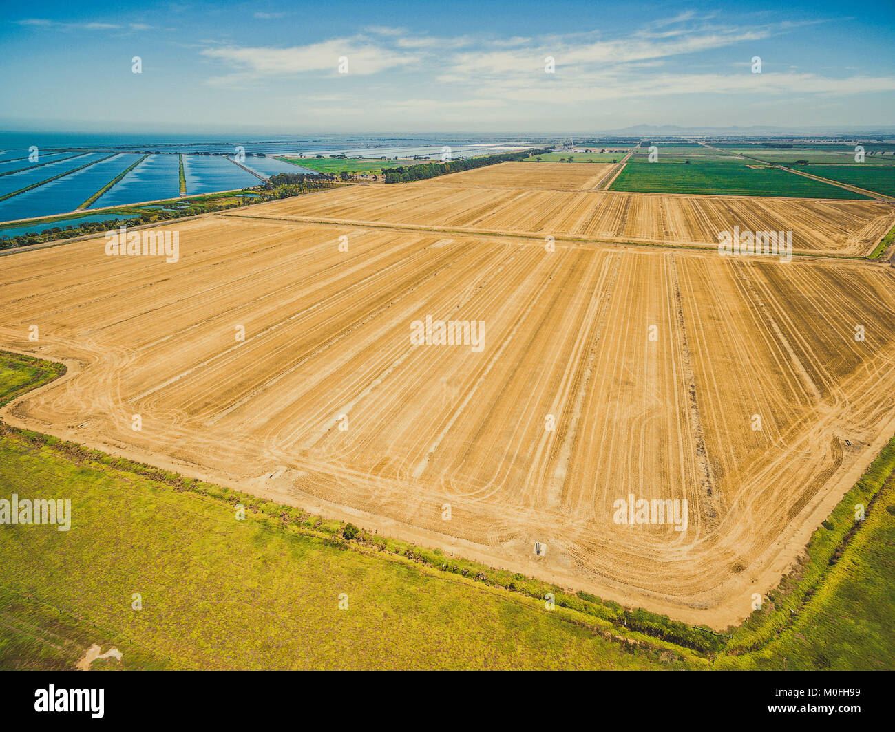 Aerial view of plowed field on bright summer day Stock Photo - Alamy