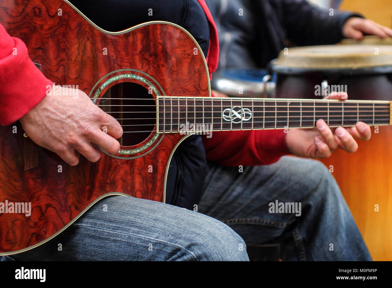 Guitar player plays on acoustic hi-res stock photography and images - Alamy