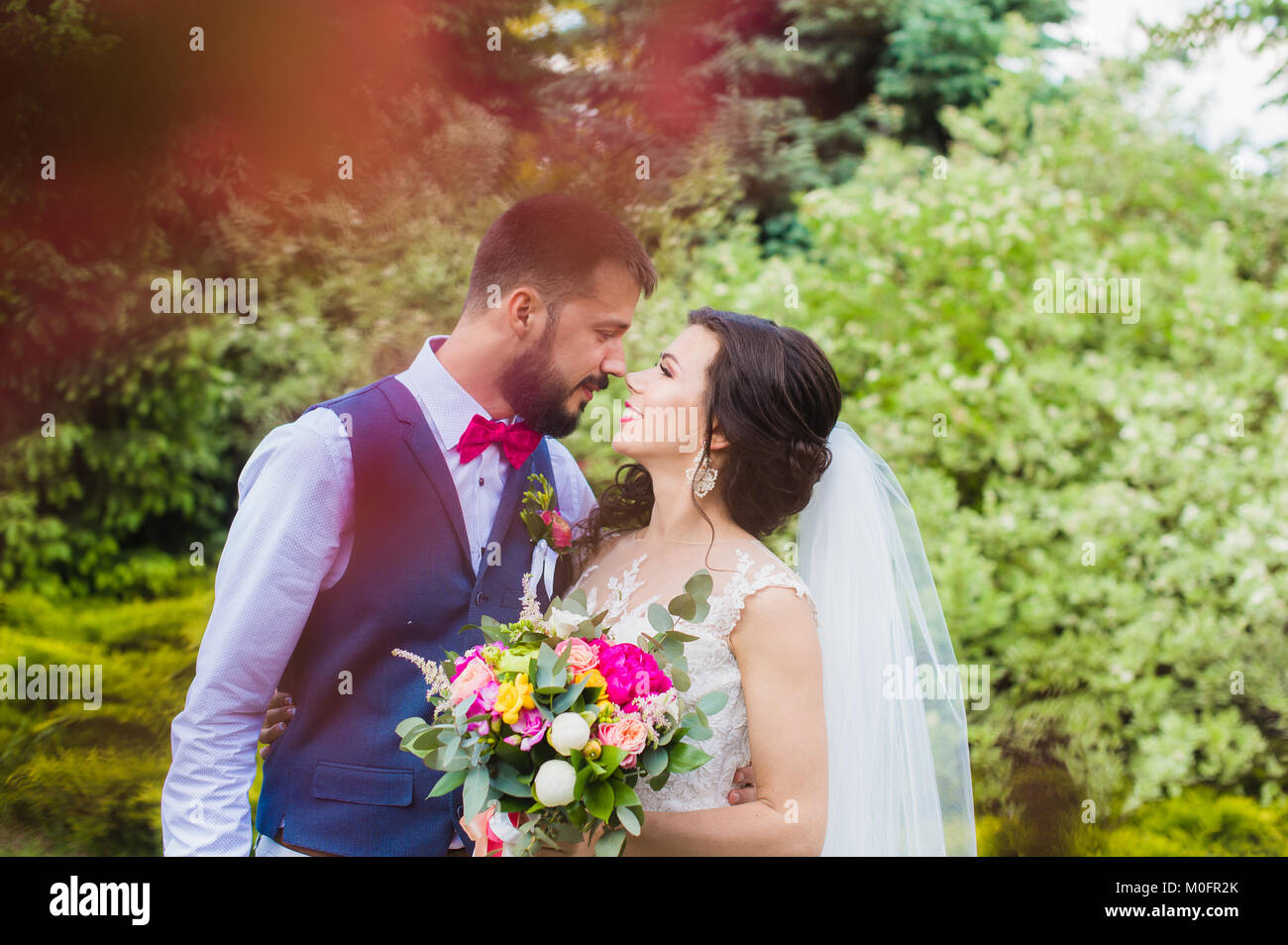 Beautiful stylish bride and groom became husband and wife posing in ...