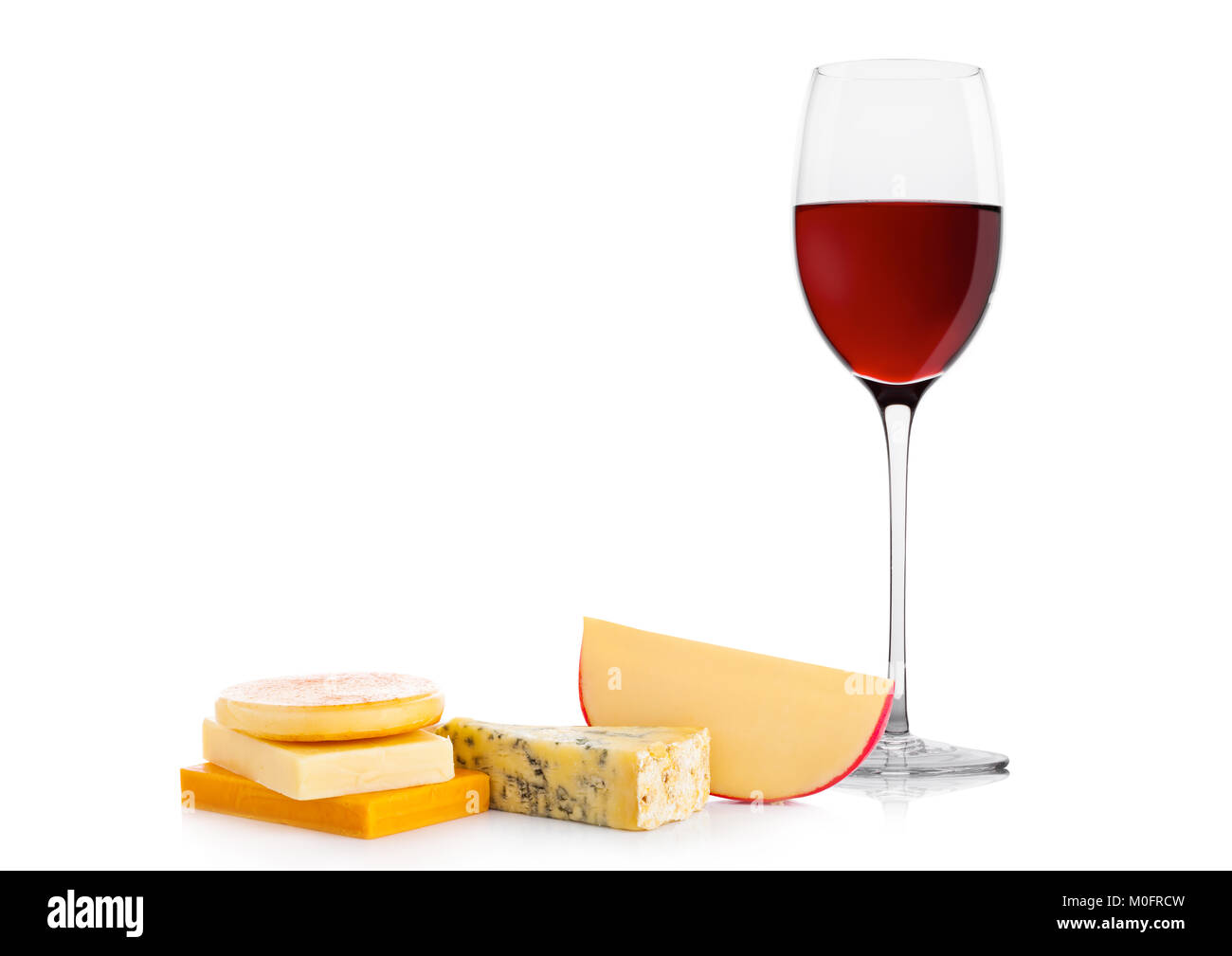 Glass of red wine with cheese selection and grapes on white background ...