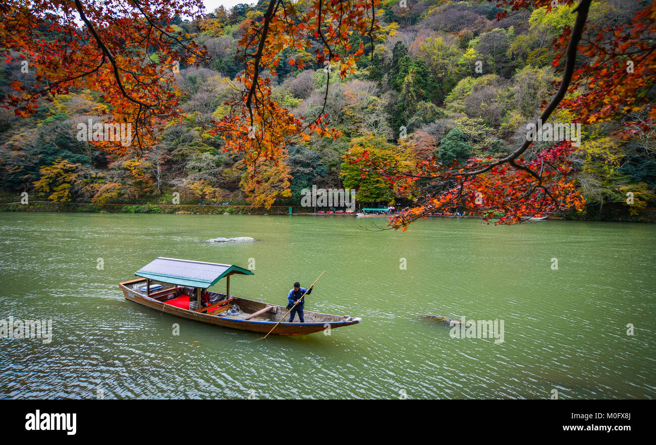 Kyoto, Japan - Nov 28, 2016. A man rowing boat on Hozu River at ...
