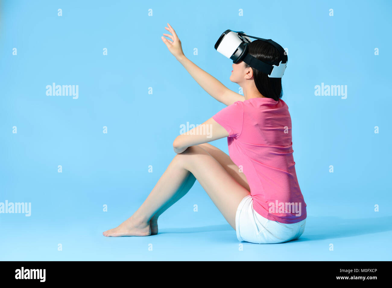 back view photo of pretty elegant woman using hand touching simulation ...