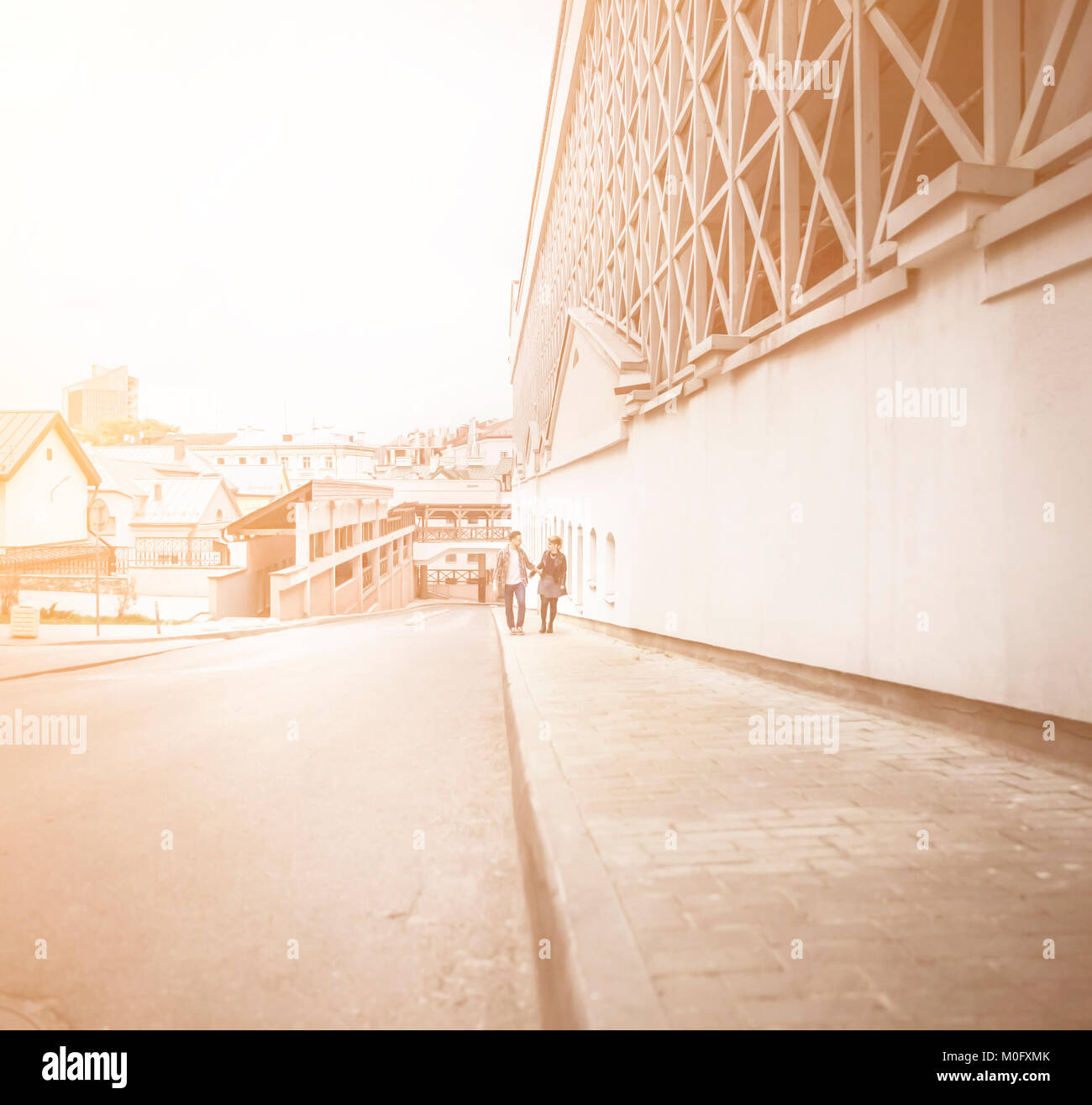 couple in love walking down the street of a modern city Stock Photo - Alamy