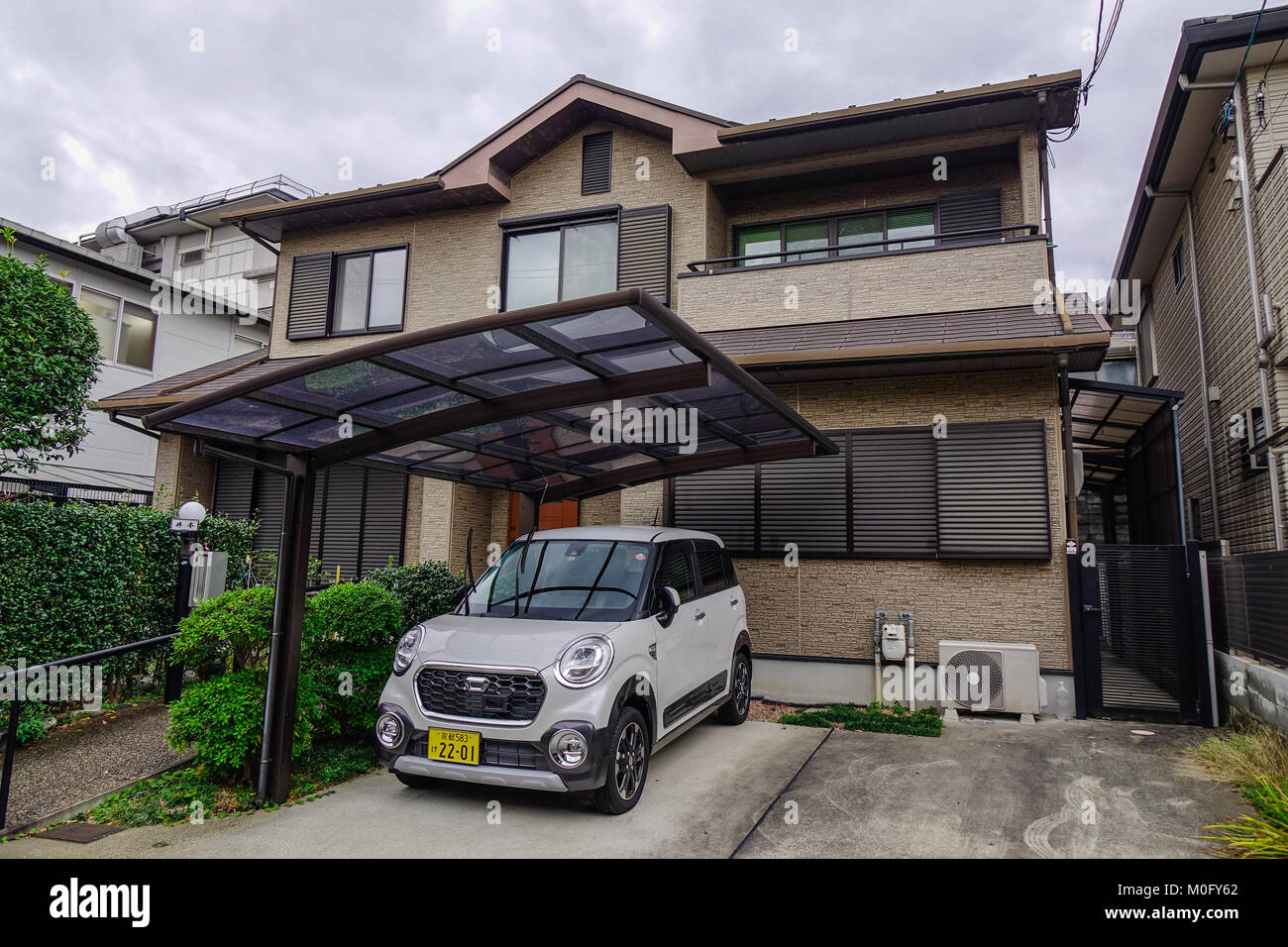 Kyoto, Japan - Nov 28, 2016. Japanese typical house with a small car at ...
