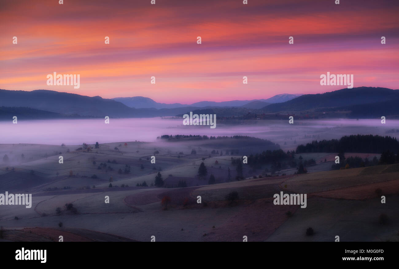 morning landscape with dramatic sky and fog Stock Photo - Alamy