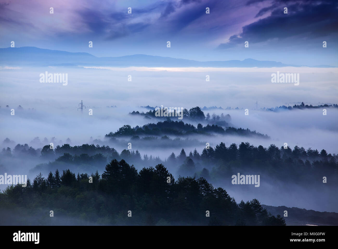 morning landscape with dramatic sky and fog Stock Photo - Alamy