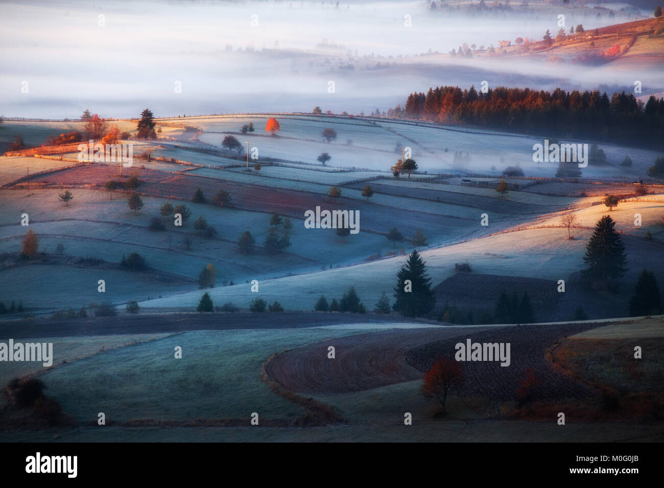 morning landscape with dramatic sky and fog Stock Photo - Alamy