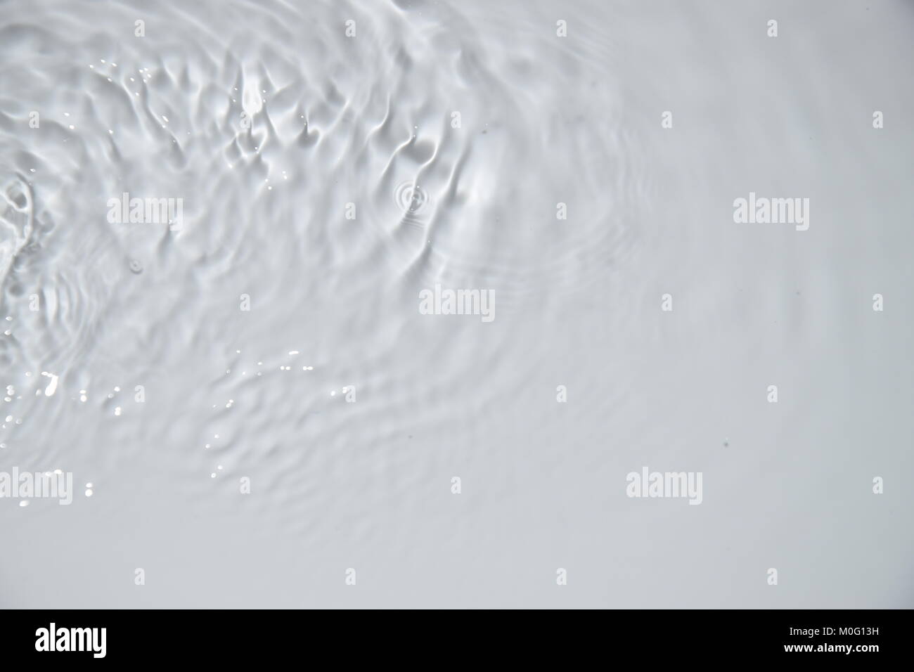 clear water on white surface for background Stock Photo - Alamy