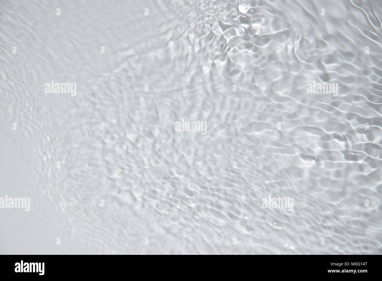 clear water on white surface for background Stock Photo - Alamy