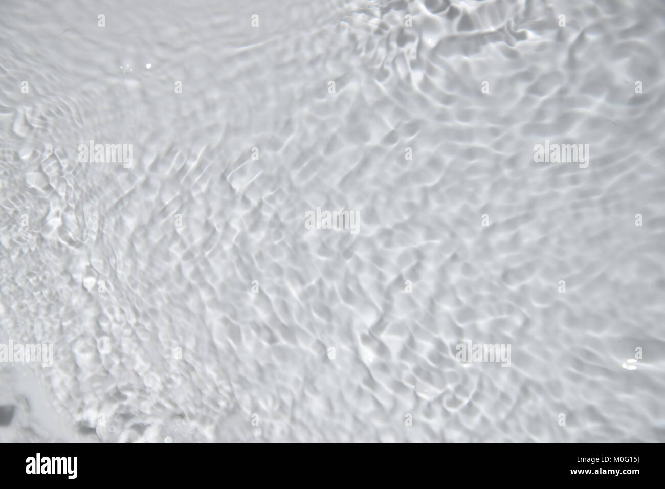 clear water on white surface for background Stock Photo - Alamy