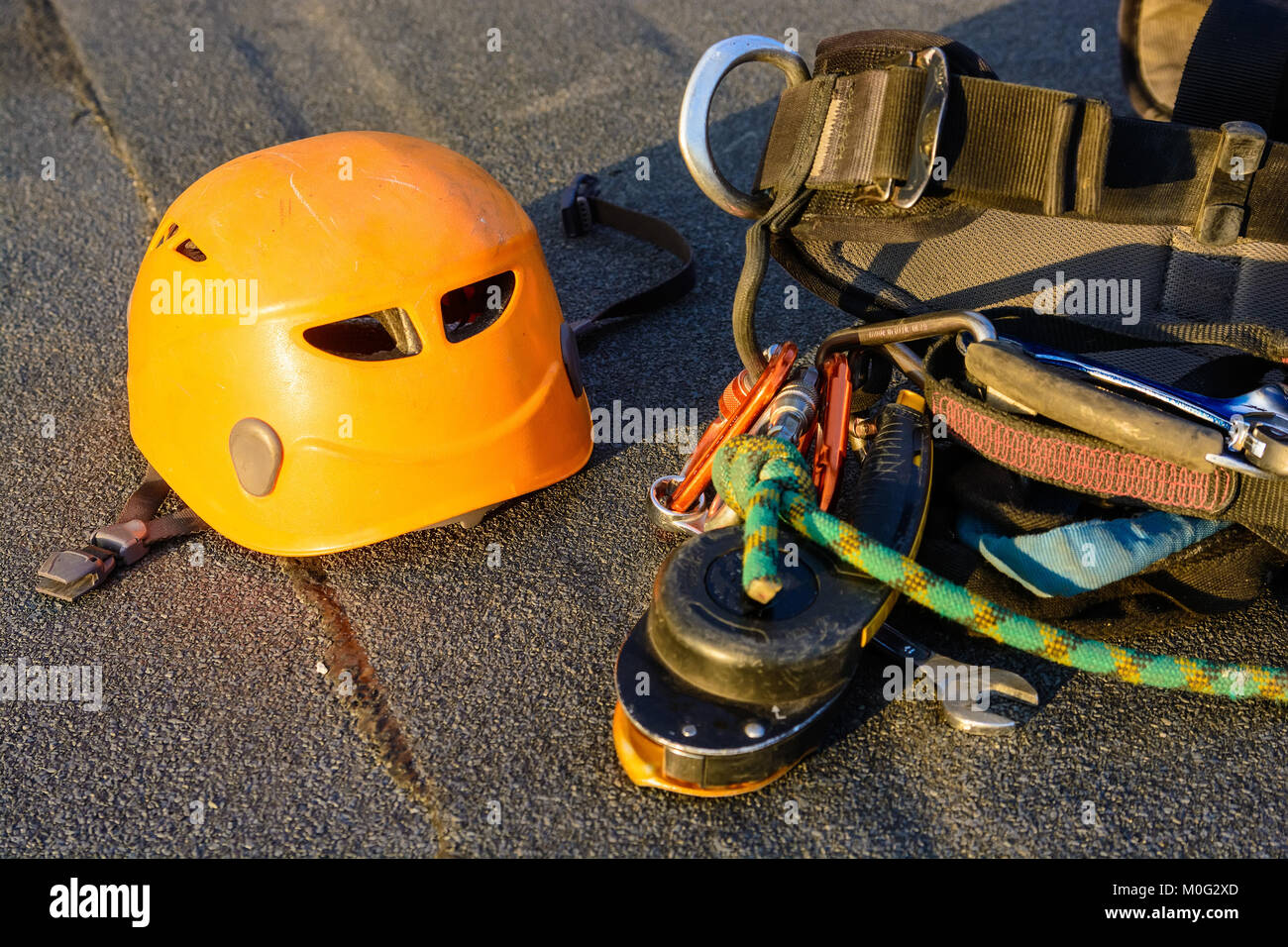 Construction worker's helmet and ropes for climbing lying on roof Stock ...
