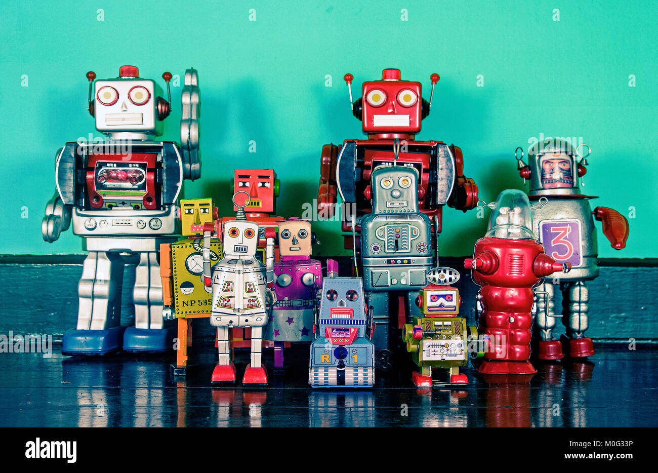 a big team of retro robots on a wooden floor Stock Photo - Alamy