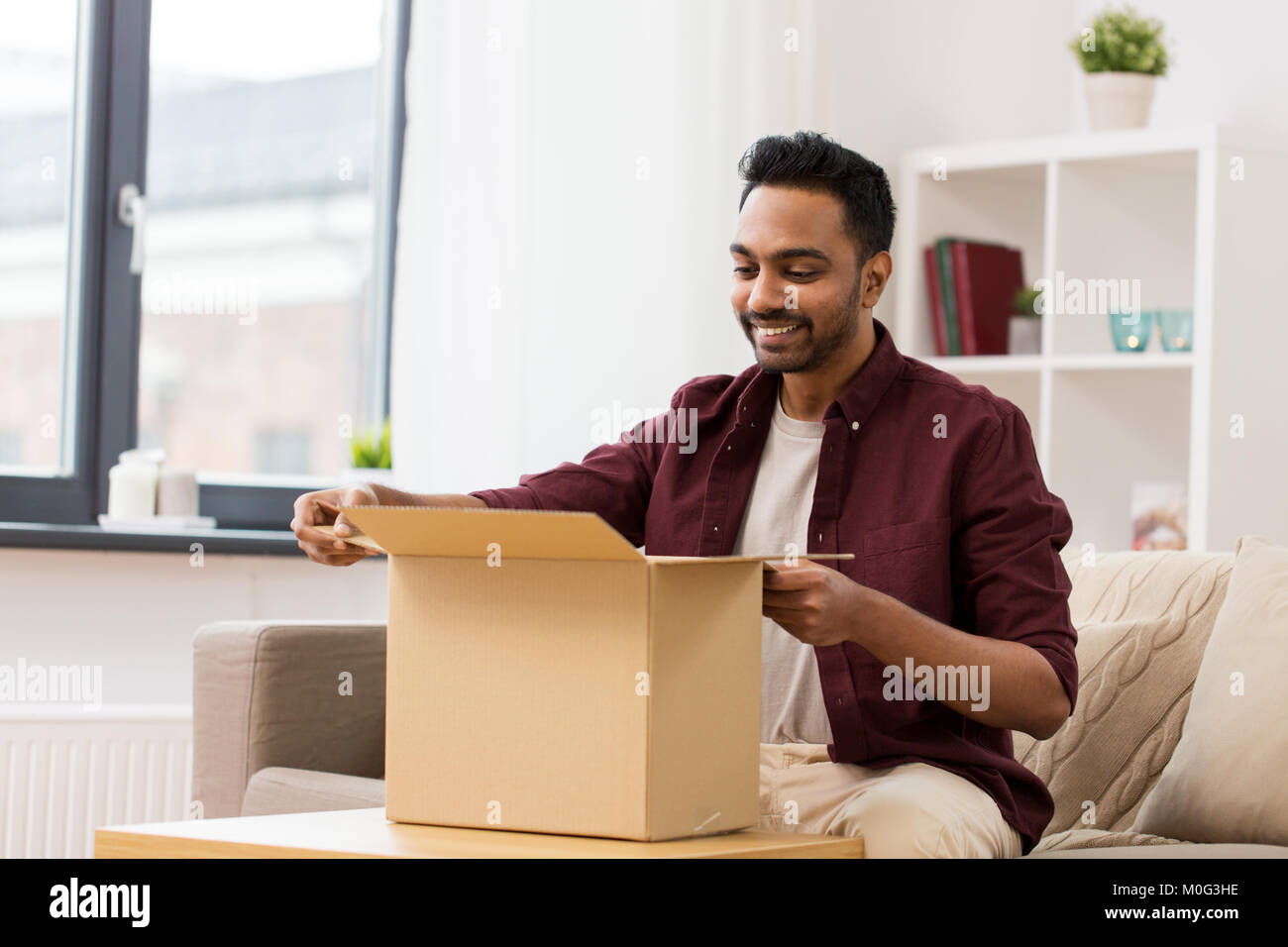 Happy person opening box hi-res stock photography and images - Alamy