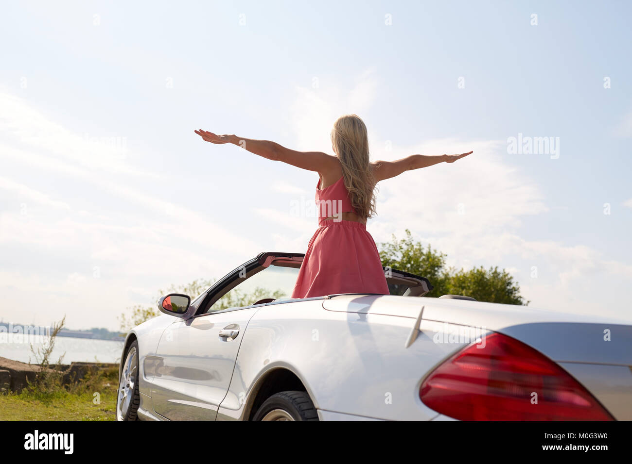 Woman driving convertible rear view hi-res stock photography and images ...
