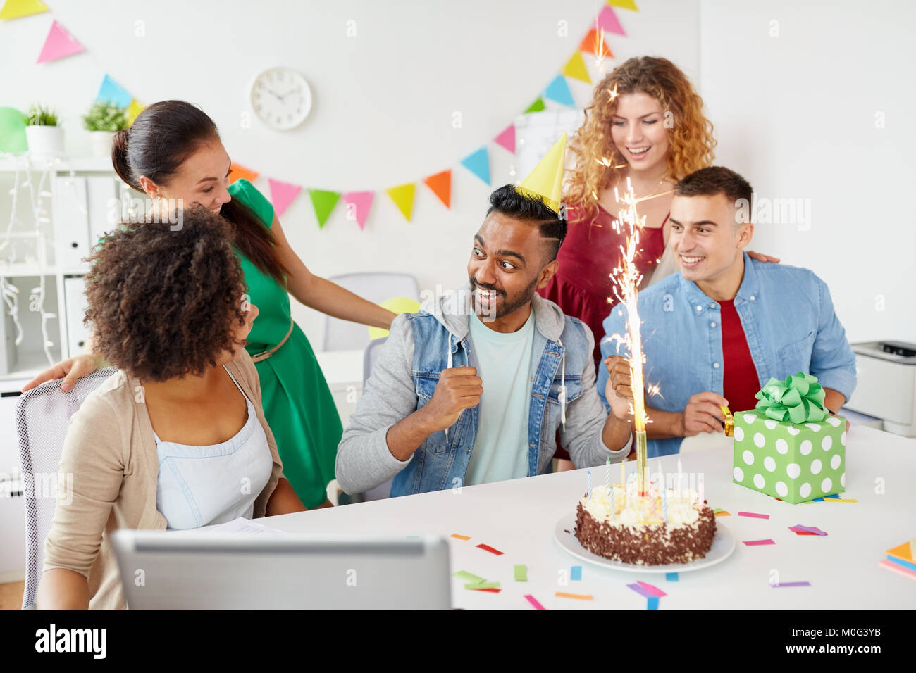 office team greeting colleague at birthday party Stock Photo - Alamy