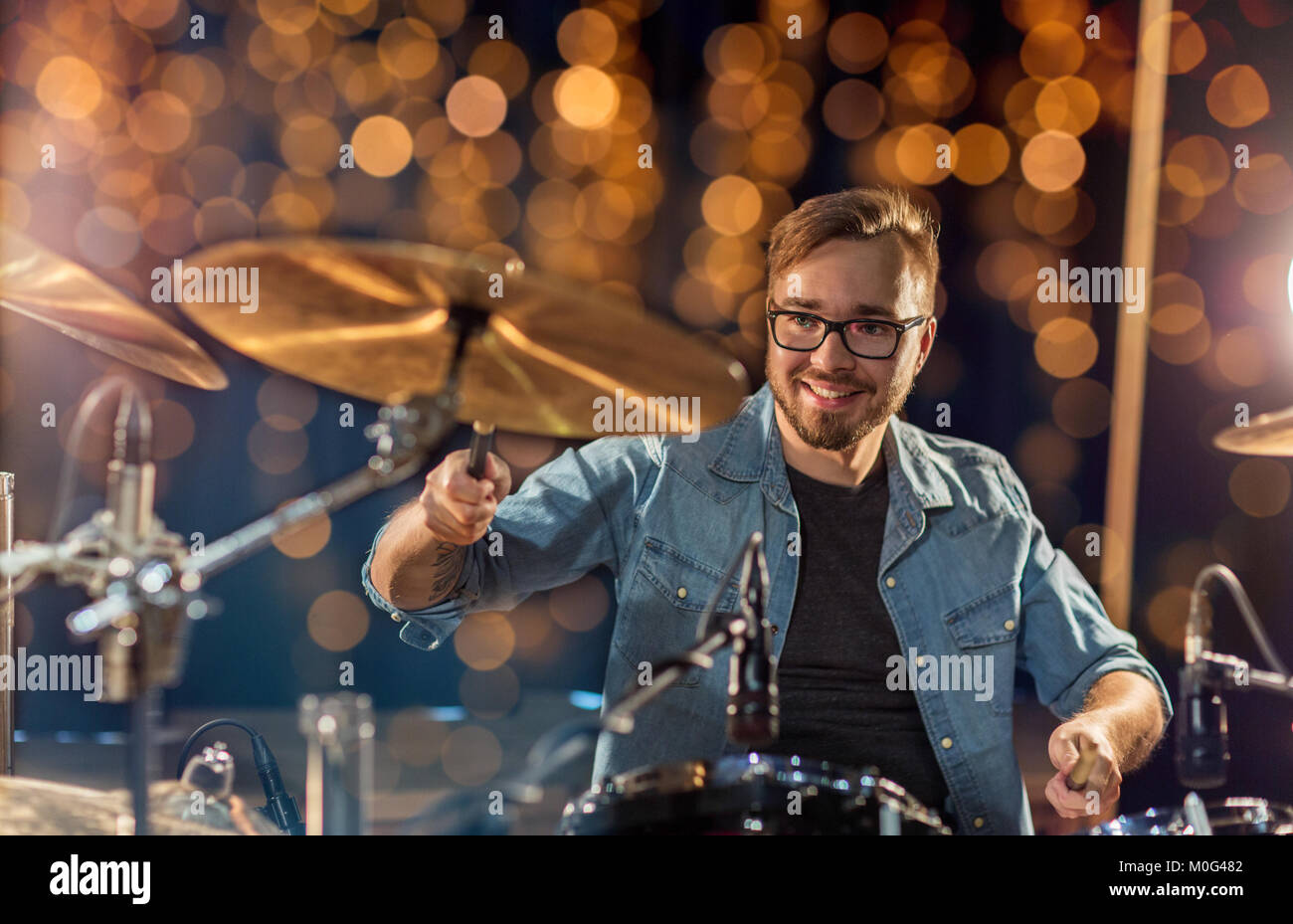 musician or drummer playing drum kit at concert Stock Photo - Alamy