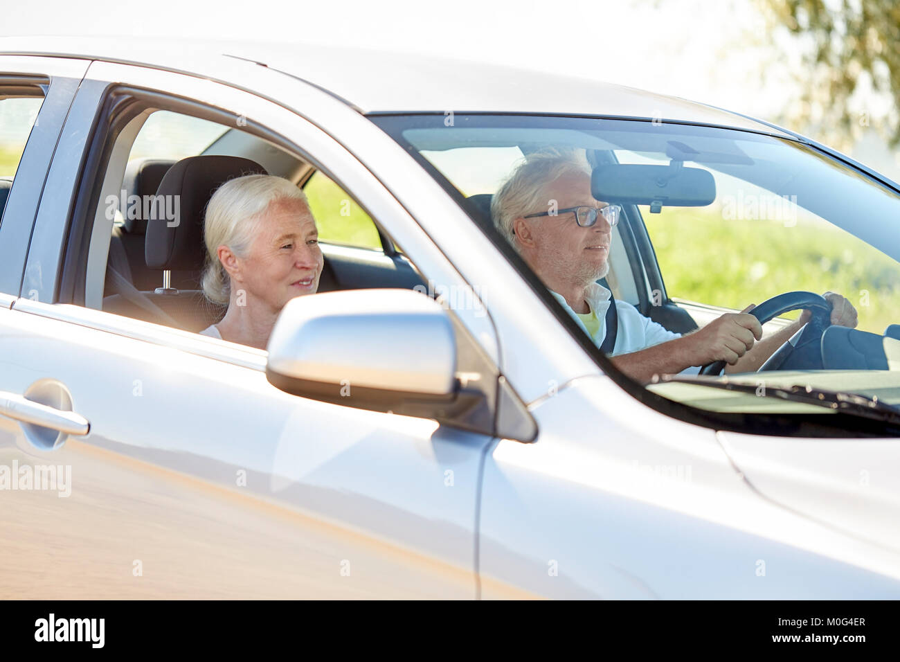 happy senior couple driving in car Stock Photo - Alamy