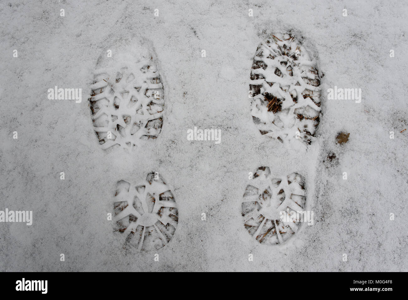 Traces of hiking shoes in the snow. A walk through the fresh air in the ...