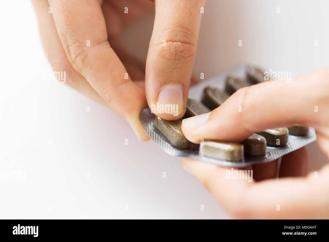 woman hands opening pack of medicine pills Stock Photo - Alamy