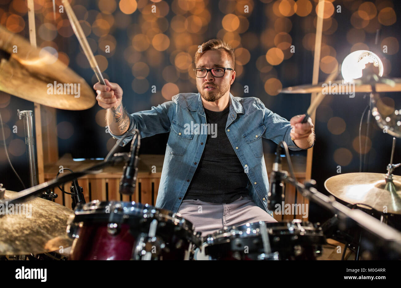 musician or drummer playing drum kit at concert Stock Photo - Alamy
